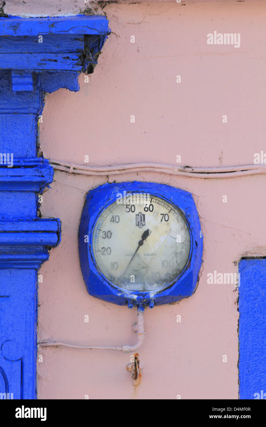 Old blue clock face on bright pink wall Schull Co County Cork west of ...