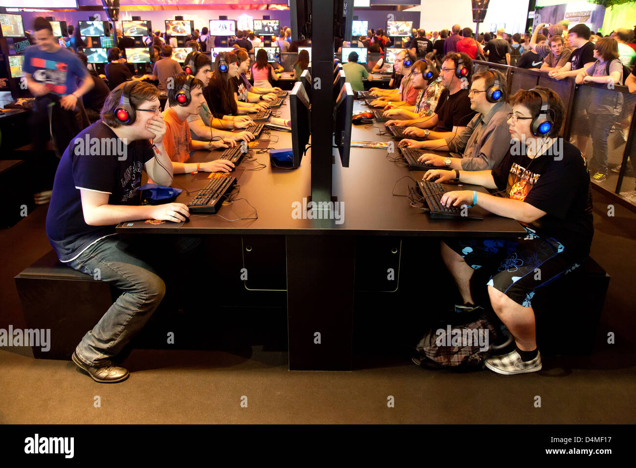 Koeln, Germany, young people playing computer games at the fair ...