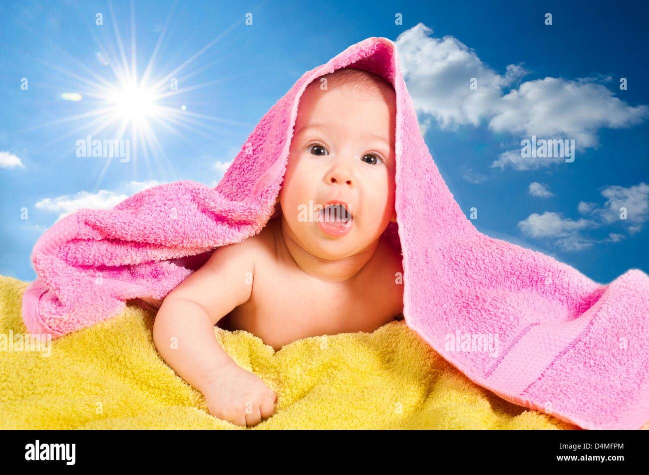 Baby with towel over head hi-res stock photography and images - Alamy
