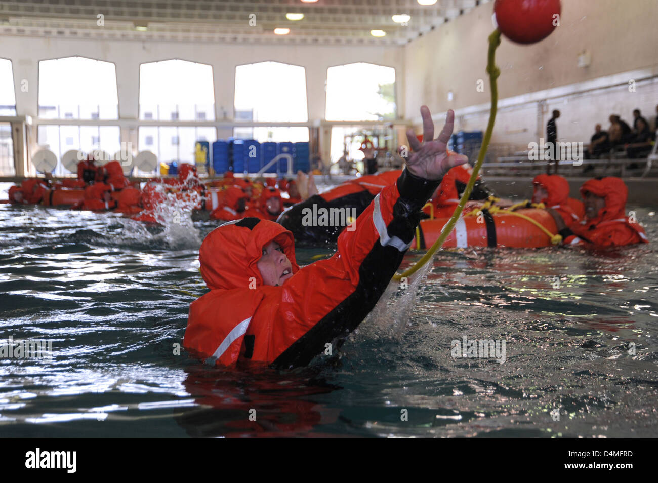 A U.S. Coast Guard crew completes the last heaving line toss during ...