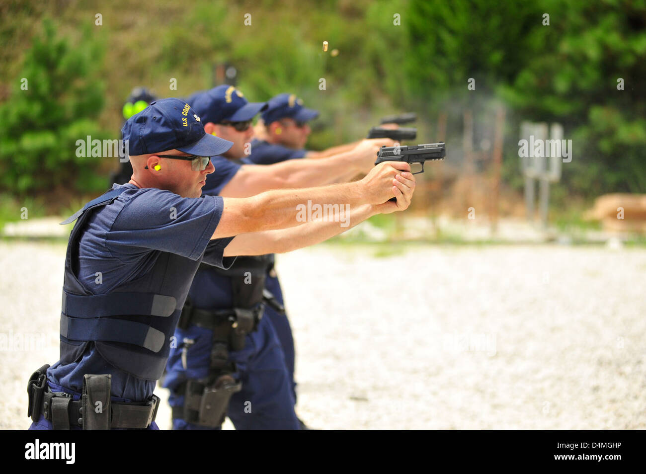 A U.S. Coast Guard gunner's mate participates in a 40-caliber pistol ...