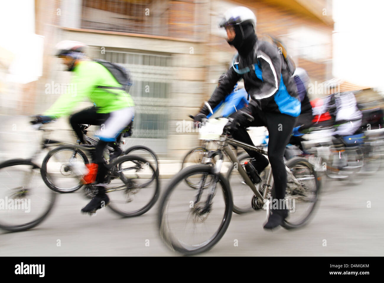 Mountain bike race, shot with low shutter speed to achieve motion blur ...