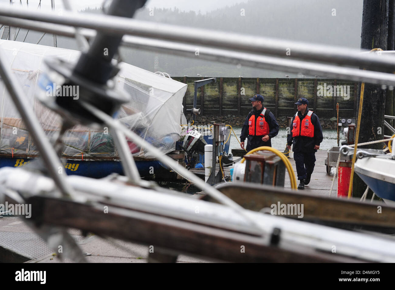 The Coast Guard responds to a rainstorm at Aurora Harbor, demonstrating ...