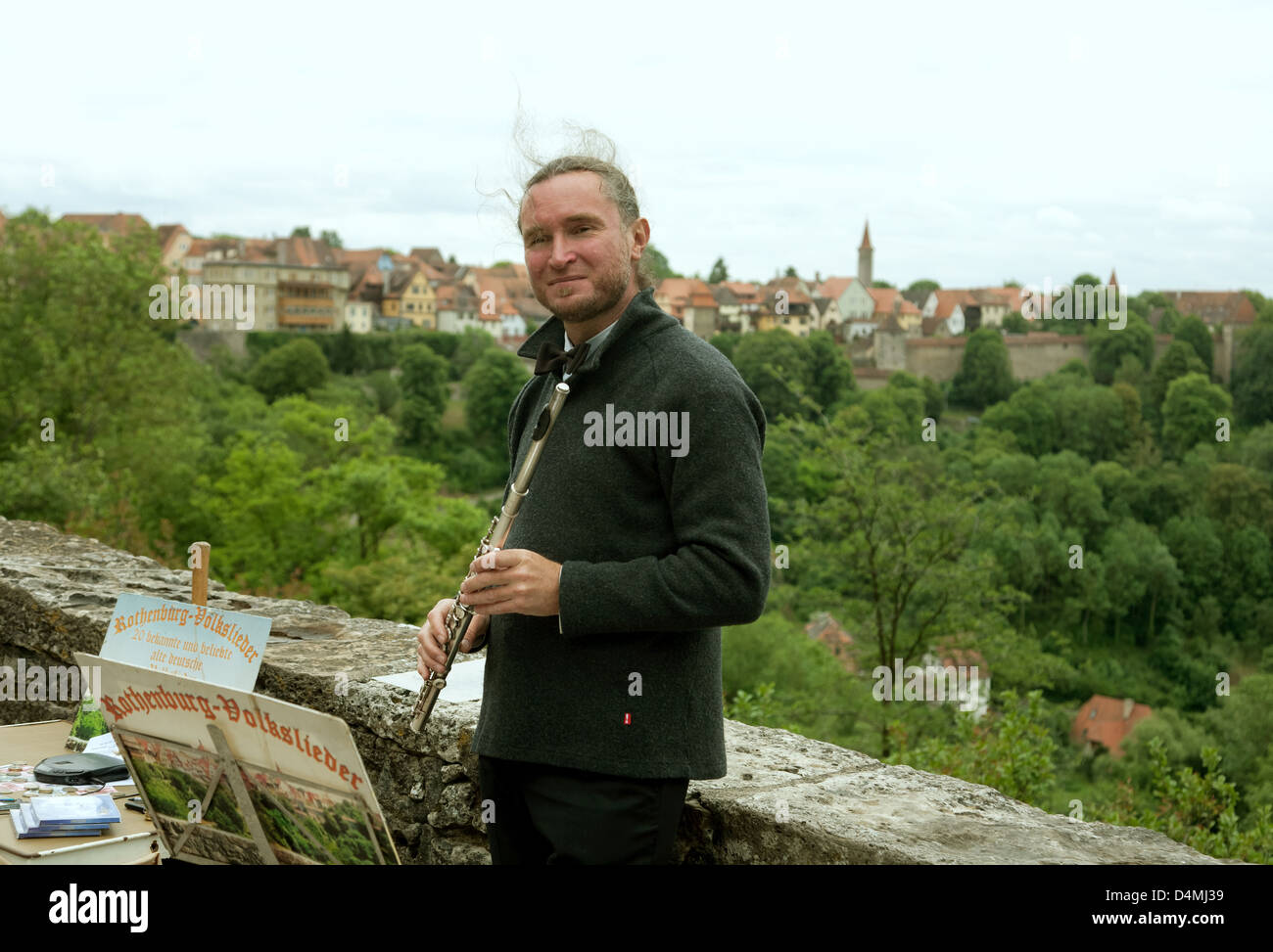 Rothenburg ob der Tauber, Germany, busker warbles medieval ways Stock ...