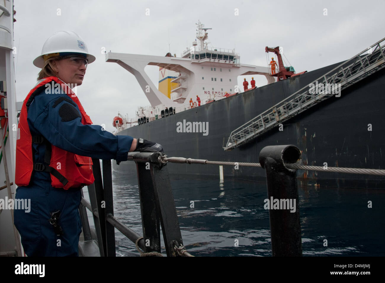 The exterior of a U.S. Coast Guard vessel is being inspected as part of ...