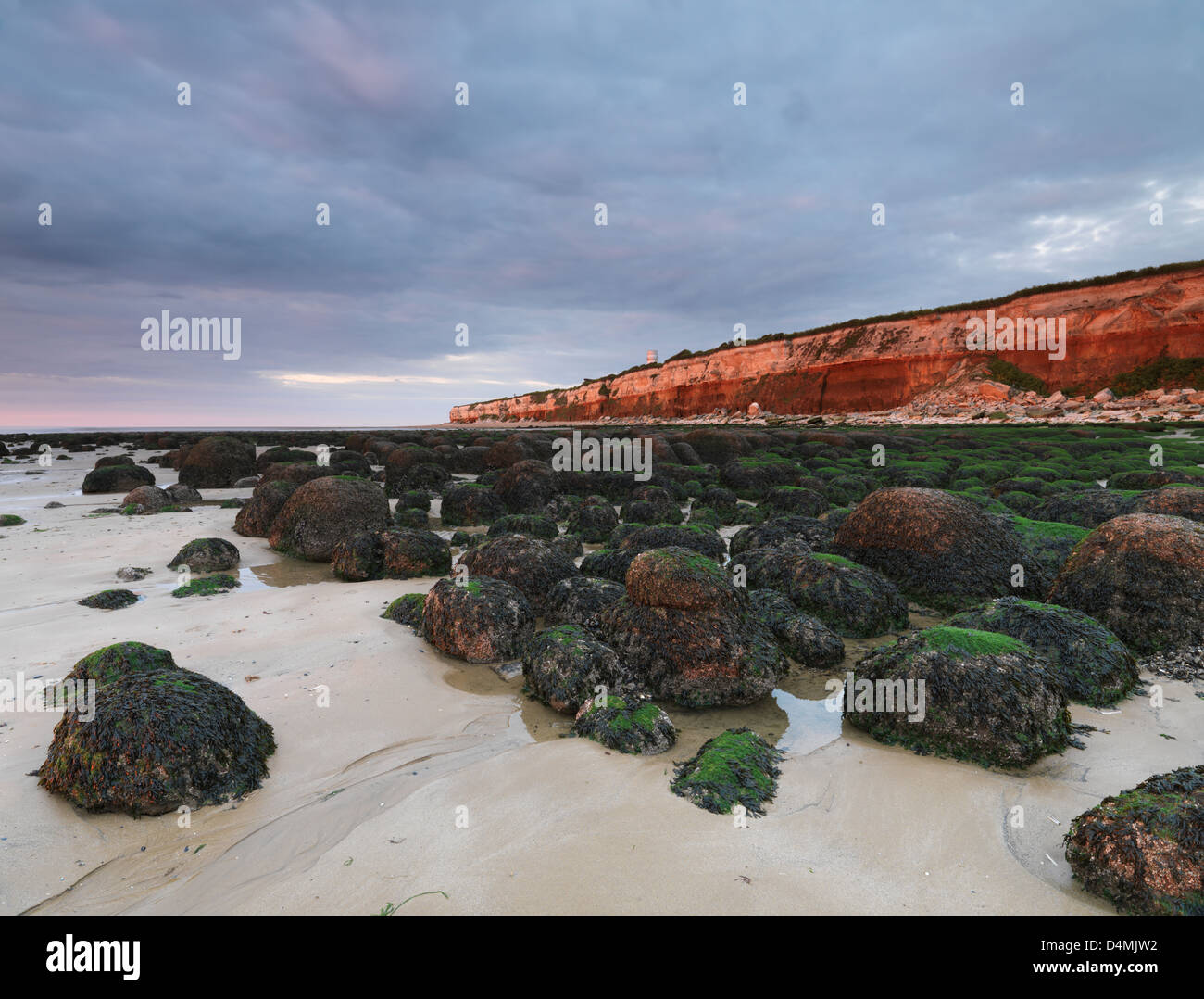 Low tide at Hunstanton on the North Norfolk Coast with it's distinctive ...