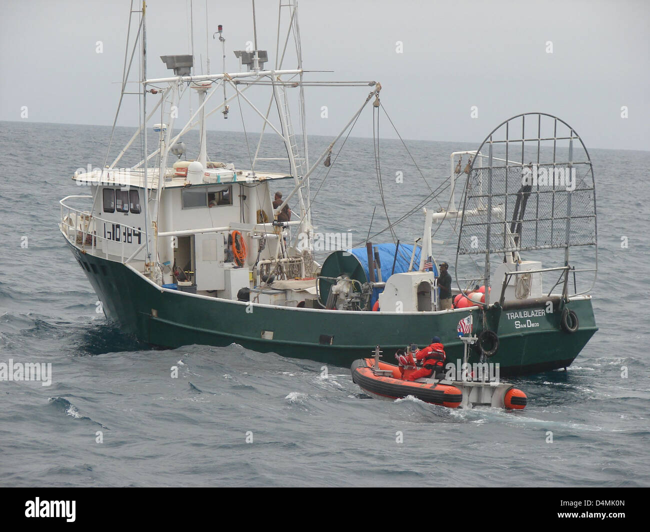 U.S. Coast Guard personnel conduct a boarding operation in San Diego as ...