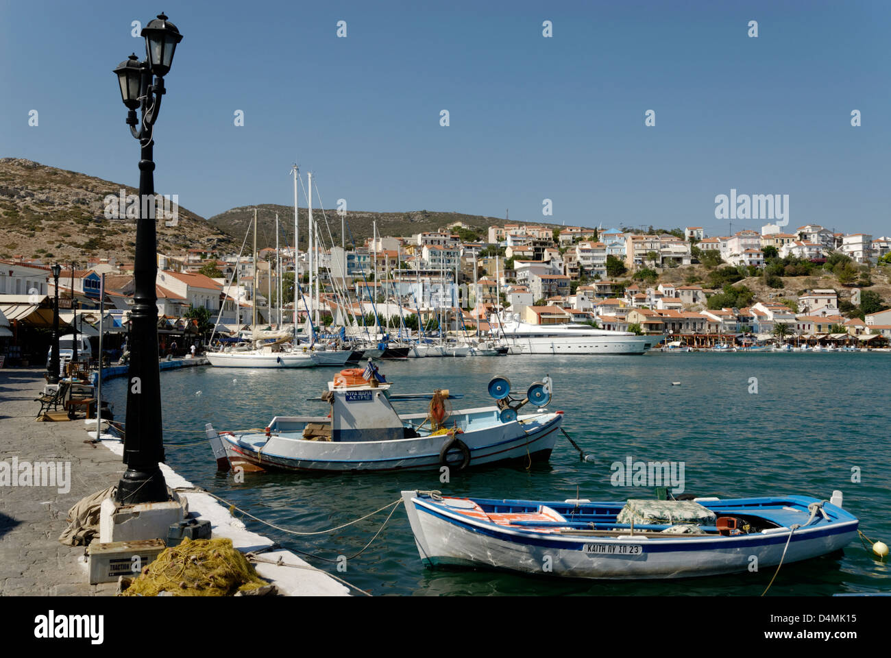 Samos. Greece. Colourful fishing boats docked in the pretty harbour of ...