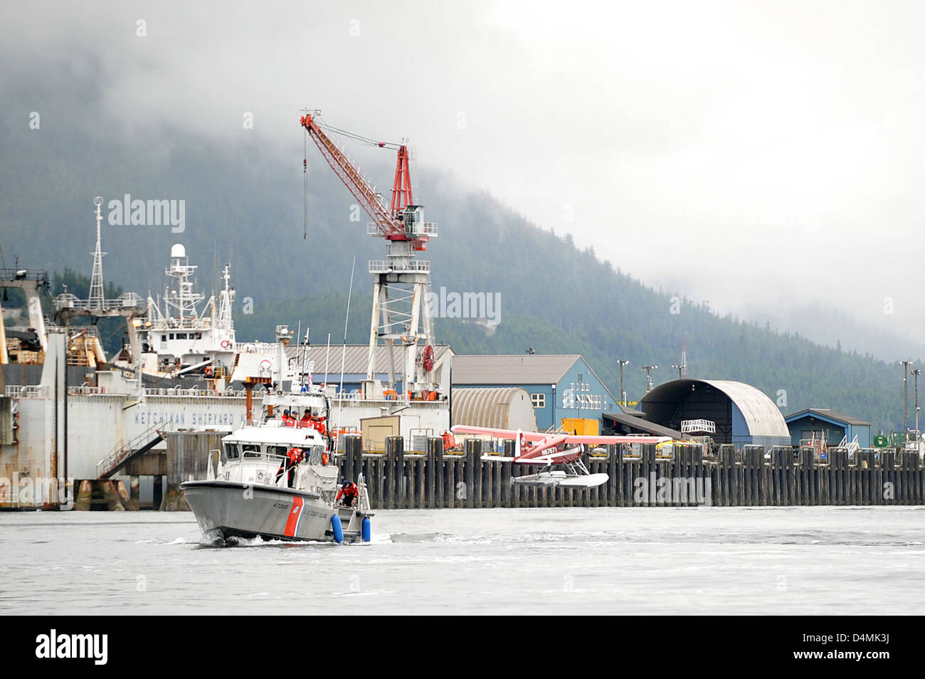 A U.S. Coast Guard float plane departs for a reconnaissance mission ...