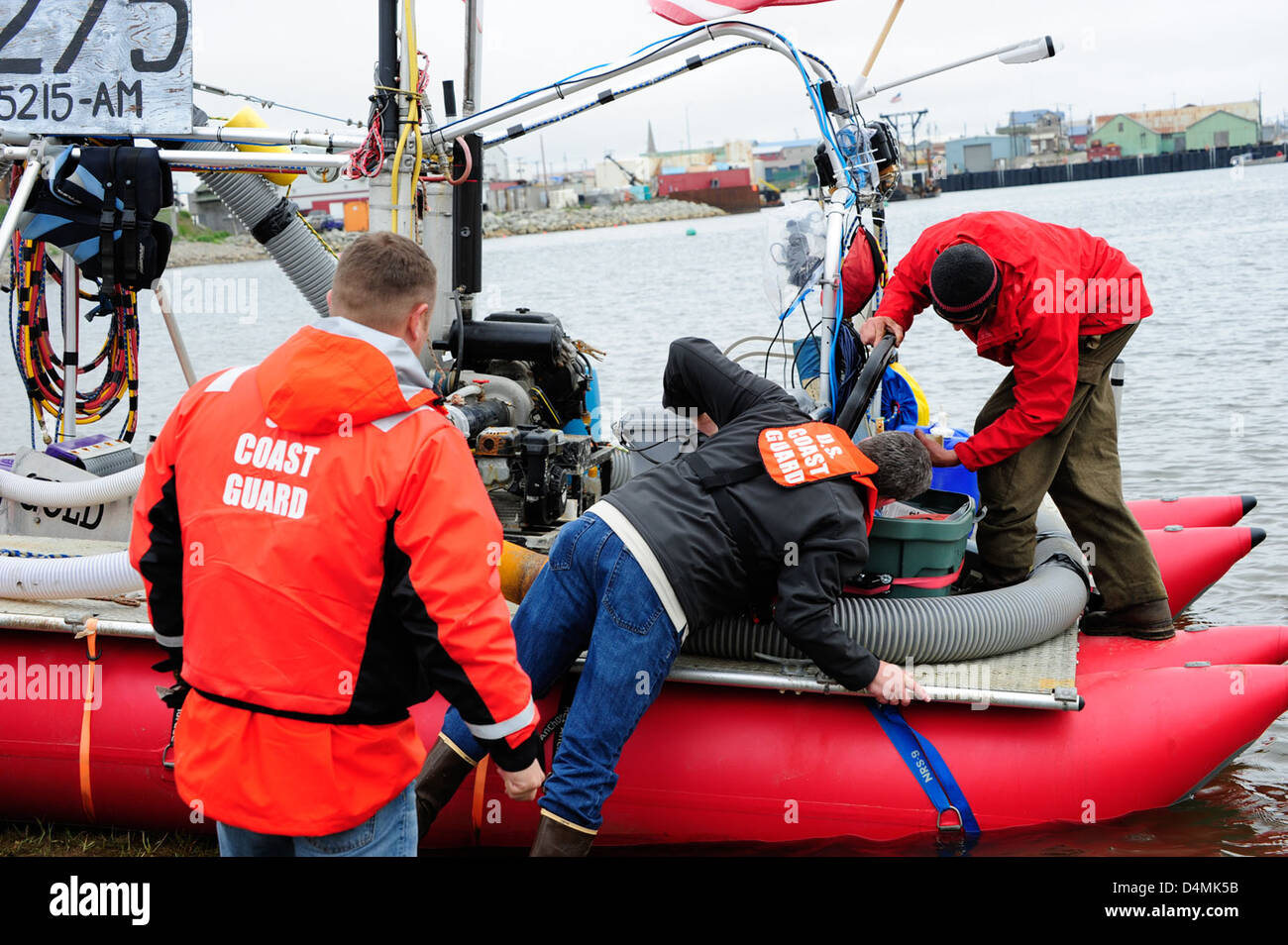Checking a gold dredge Stock Photo - Alamy