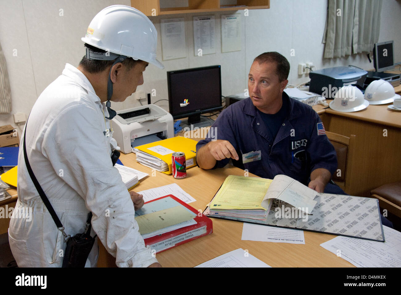 Coast Guard personnel conducted an exam of a foreign vessel to ensure ...