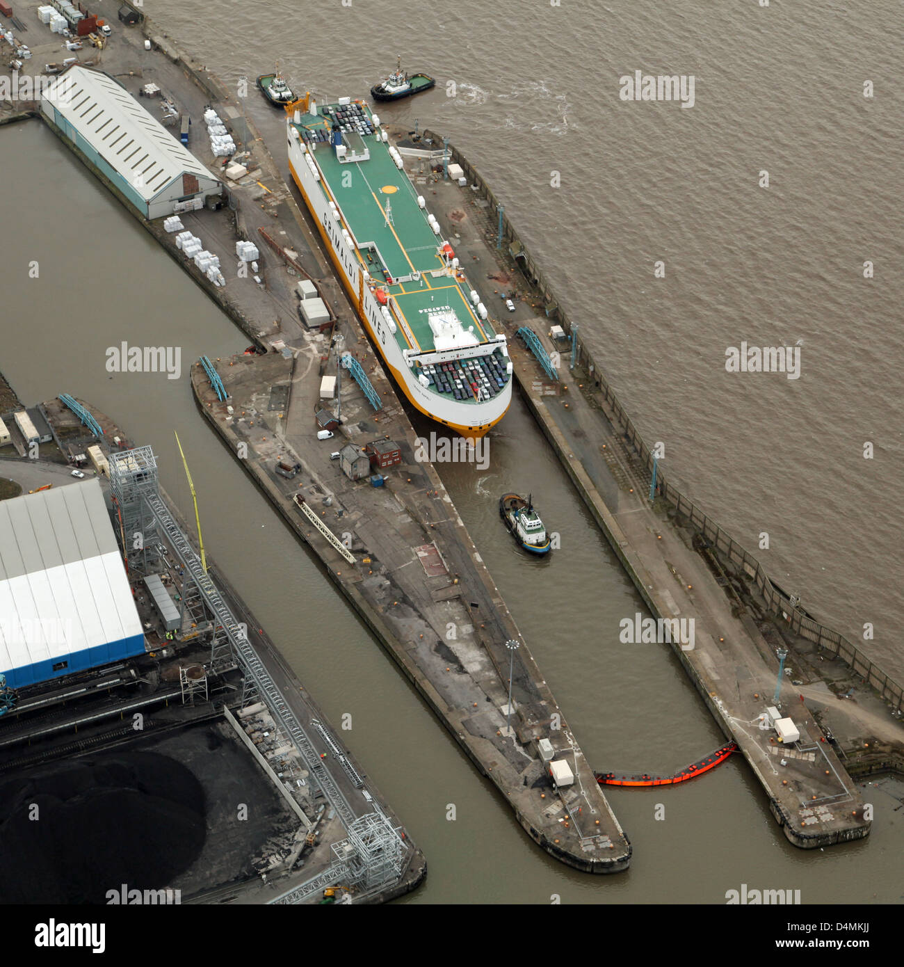 aerial view of a Grimaldi Line ship entering Gladstone Docks via a lock ...