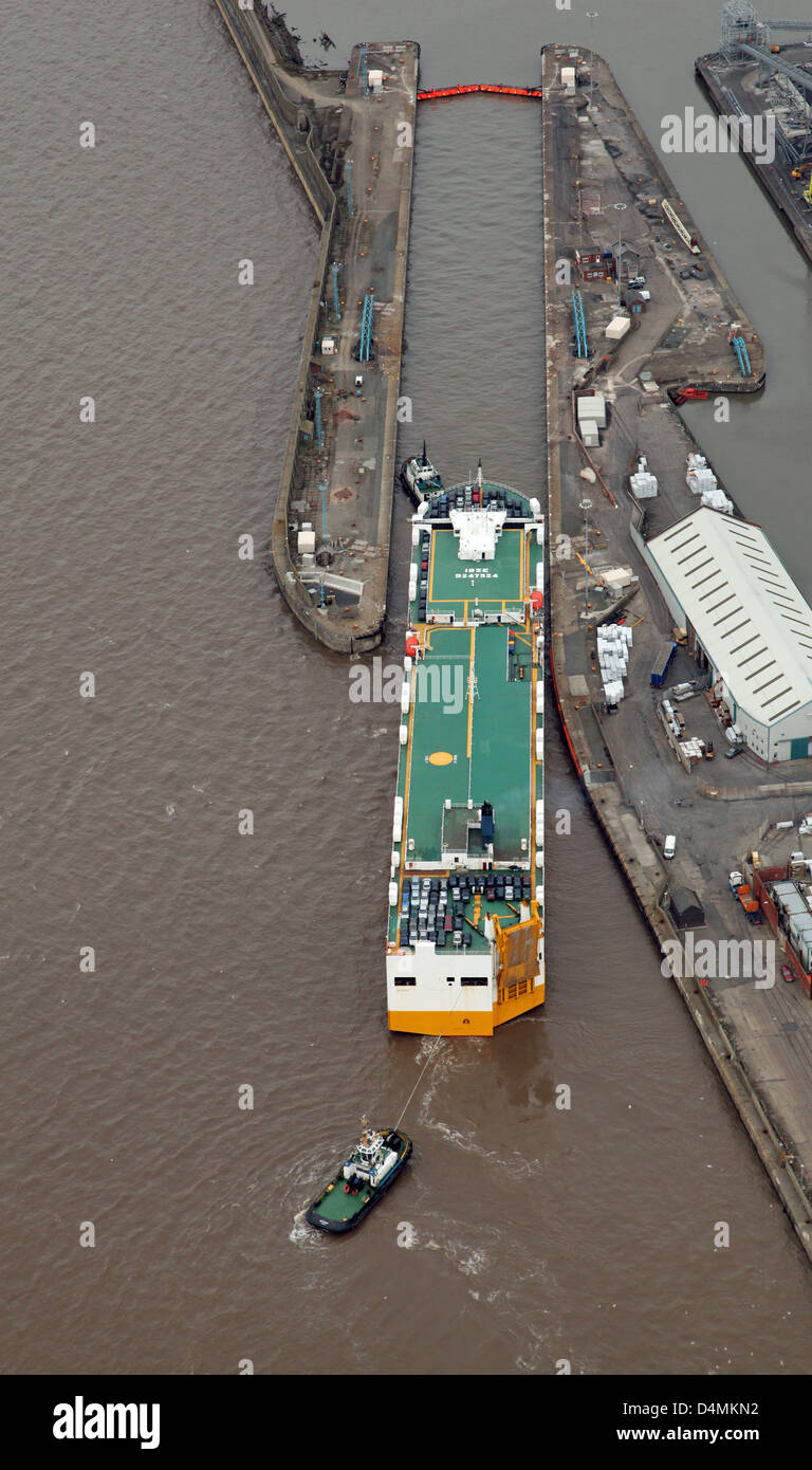 aerial view of a Grimaldi Line ship entering Gladstone Docks via a lock ...