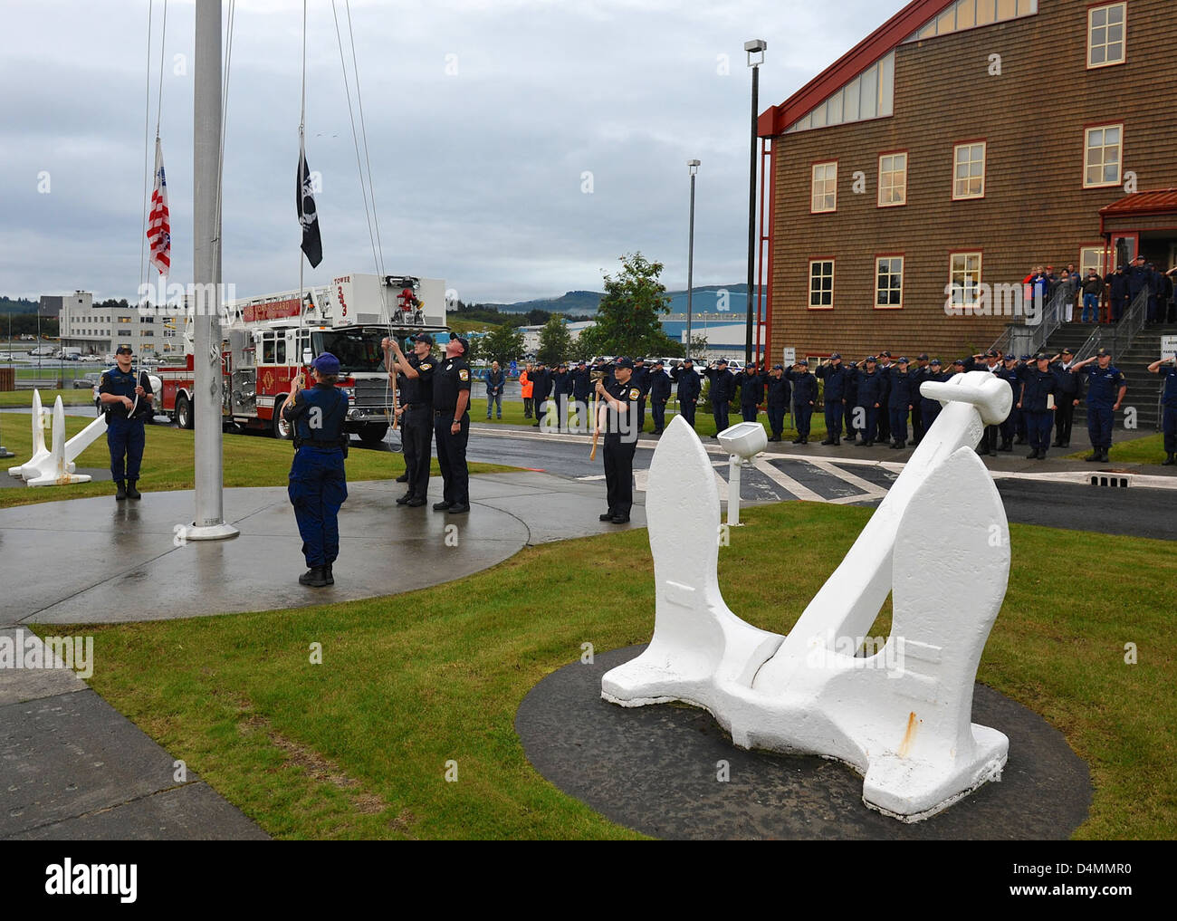 At Base Kodiak, Alaska, the raising of the American flag (colors ...