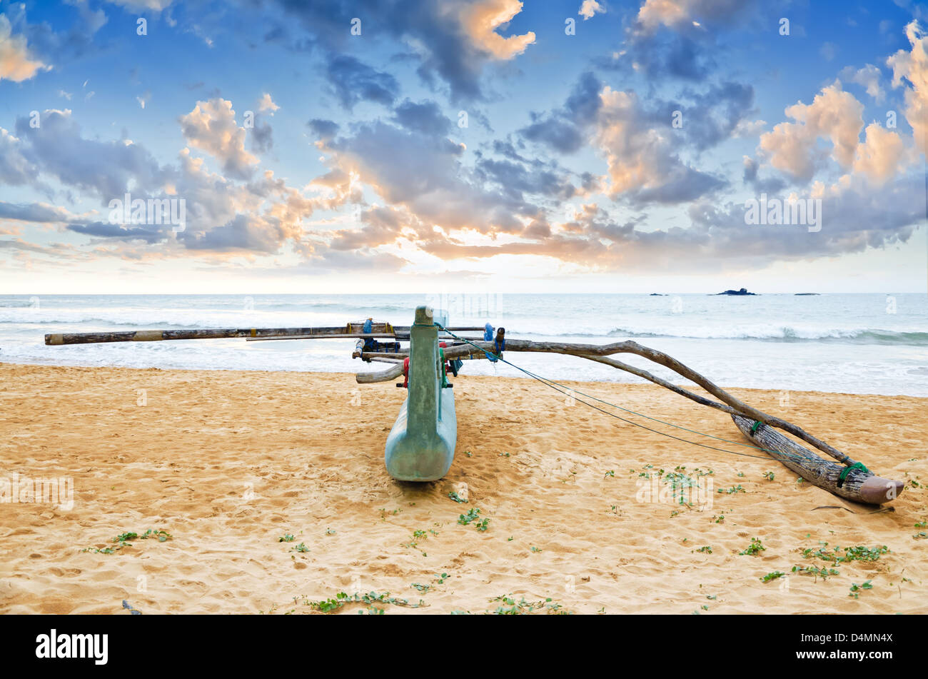 fishing boat on the scenic shore of an ocean lagoon against the ...
