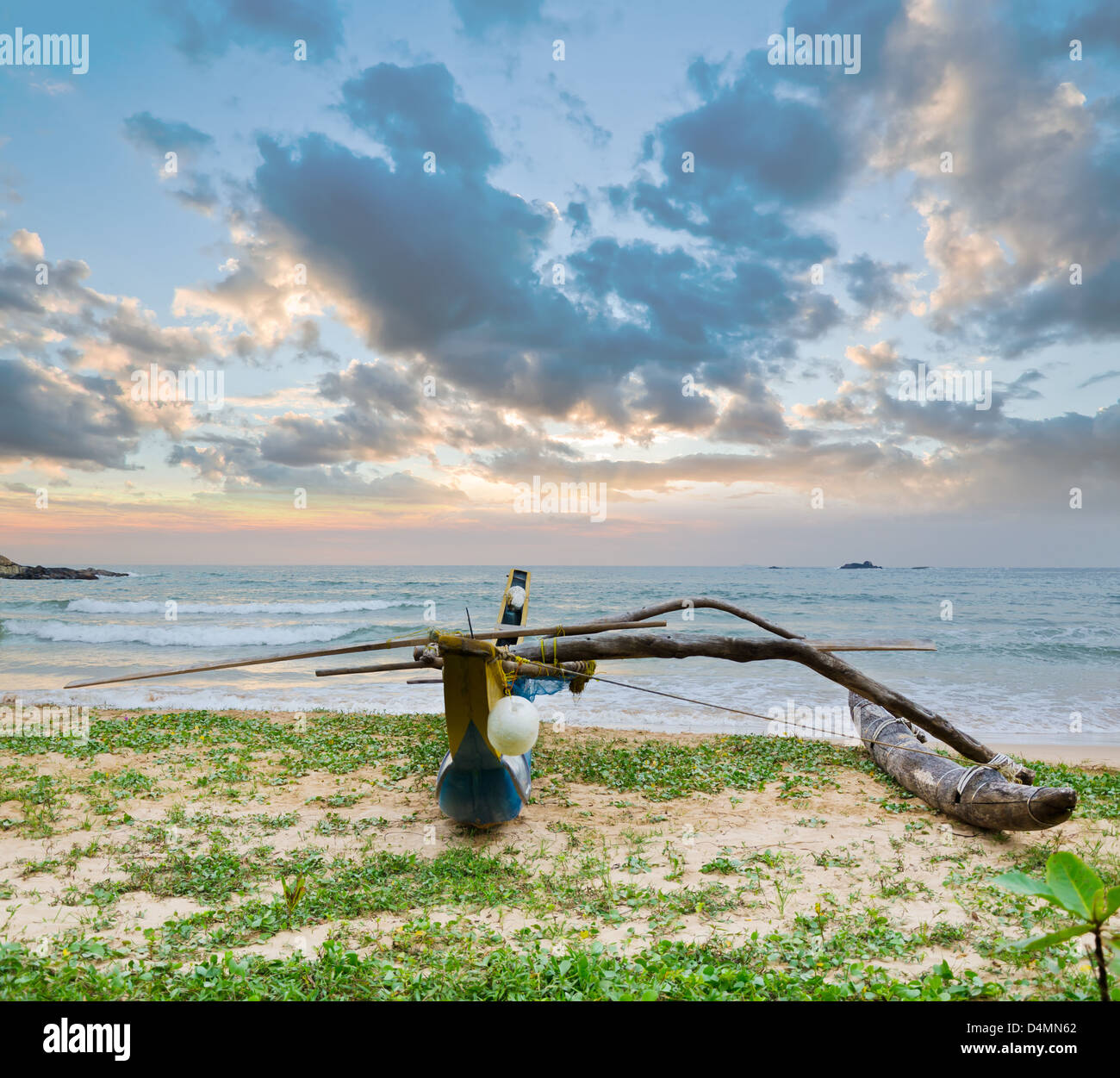 fishing boat on the scenic shore of an ocean lagoon against the ...