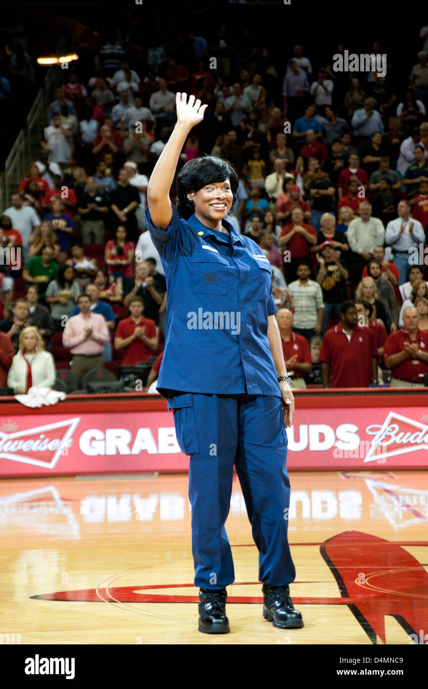 Lt. Cmdr. Zeita Merchant of the Coast Guard waved to the crowd during a ...