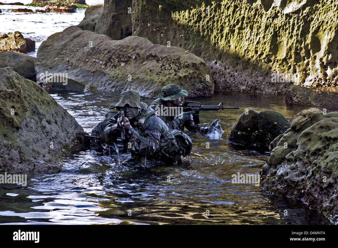 Members of the US Navy SEALs practice water insertion at the Navy ...