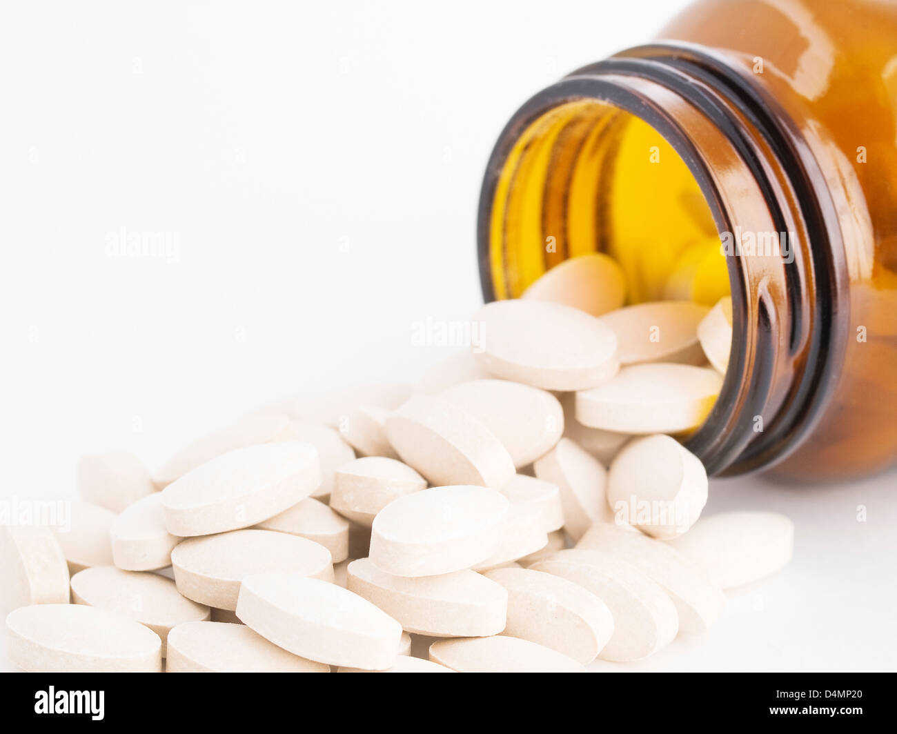 Jar with pills on white background Stock Photo - Alamy