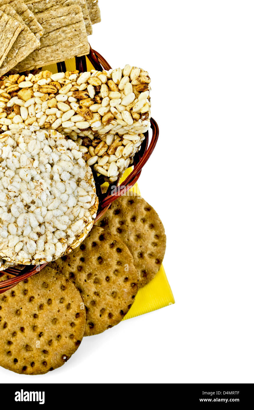 Round and rectangular cereal and rye crispbreads in a wicker basket on ...