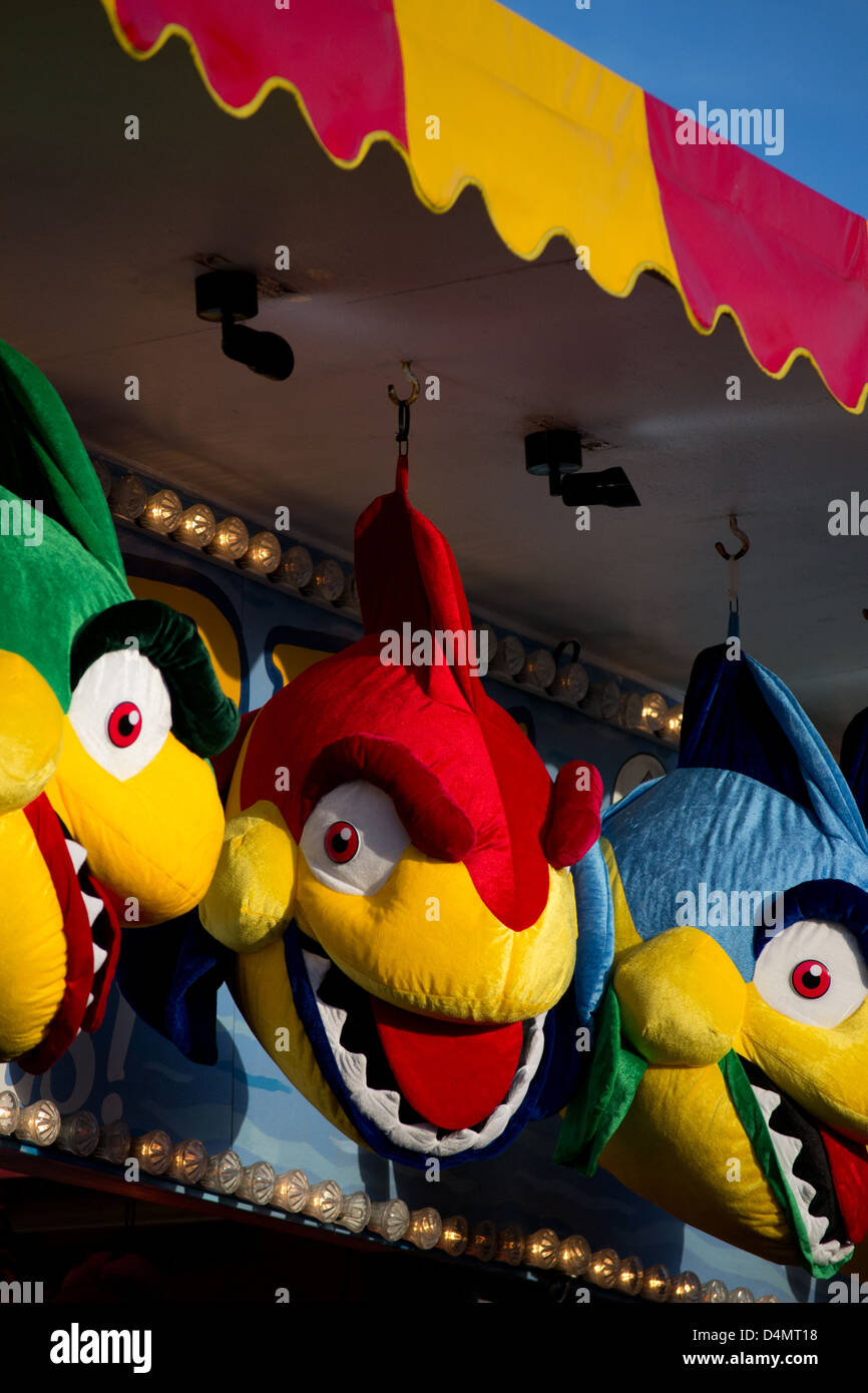 colourful soft toy shark prizes on end of Brighton Pier funfair Stock ...