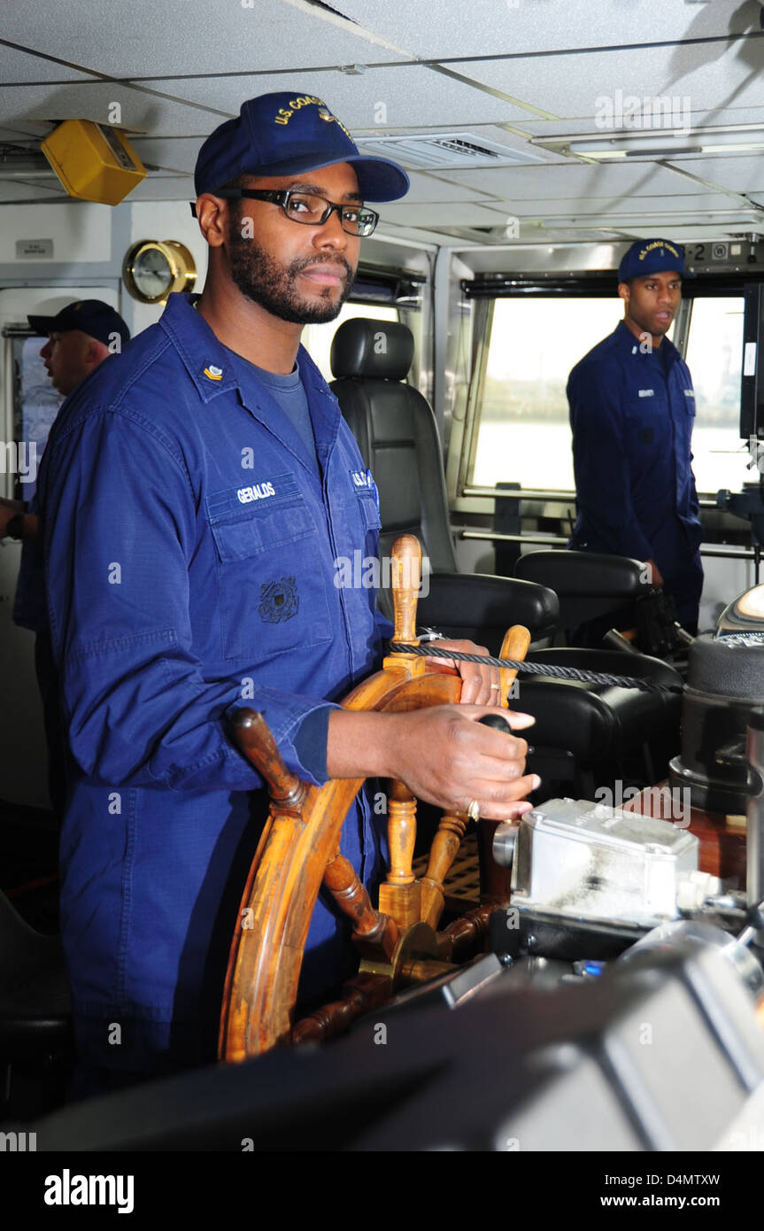 The helmsman of the U.S. Coast Guard Cutter Bristol Bay, a 140-foot ...