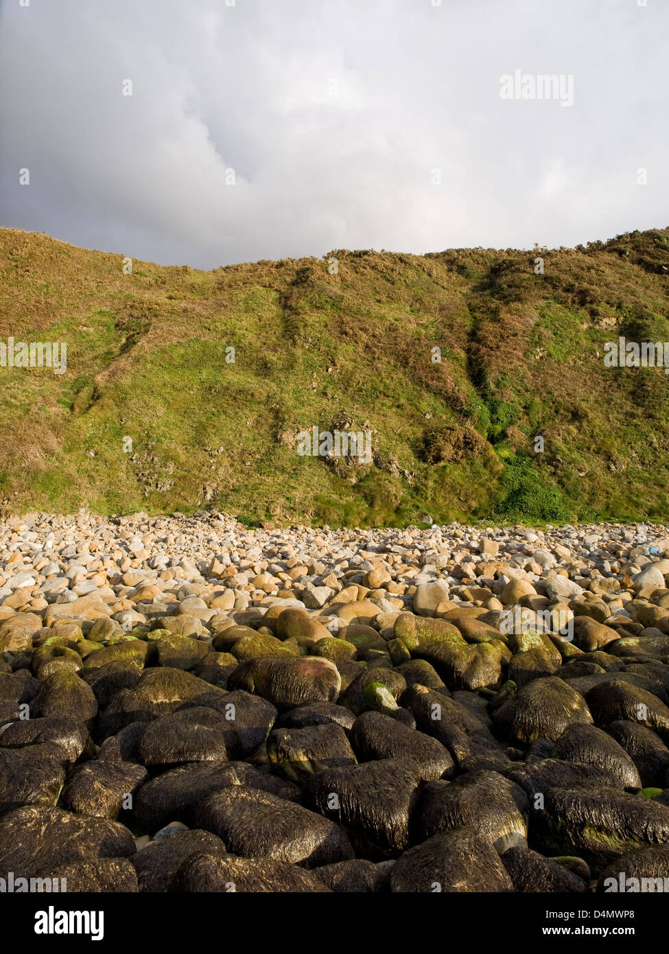 Coastal landscape with mountains, rocks and sky.The photograph was ...