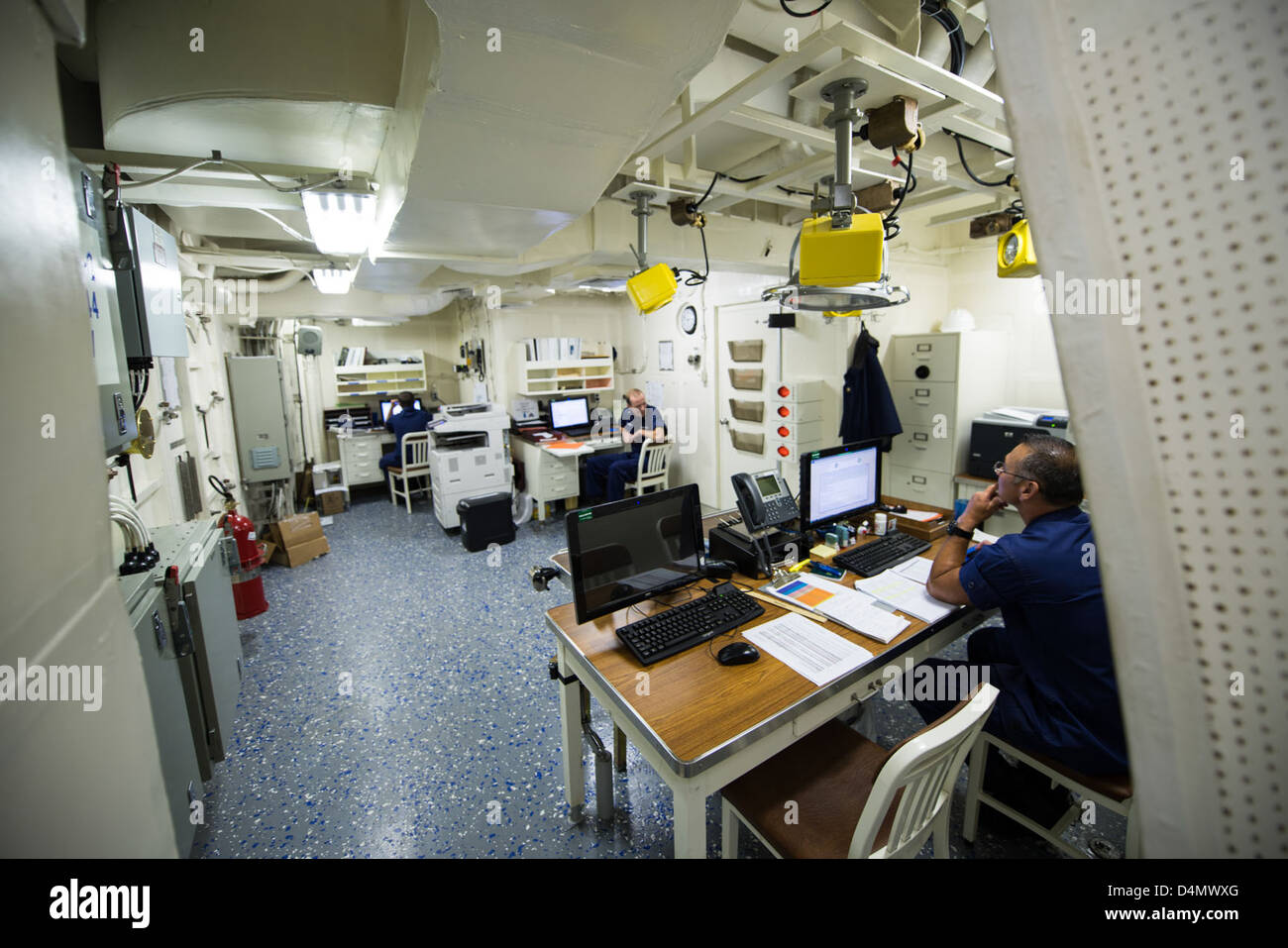 Two U.S. Coast Guard yeoman carry out essential administrative tasks ...