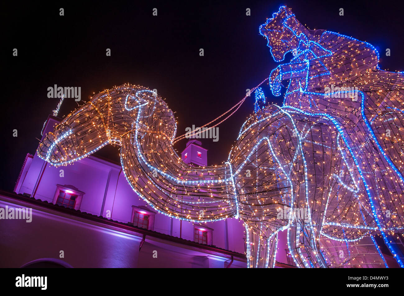 A lit up camel with a church behind it Stock Photo - Alamy