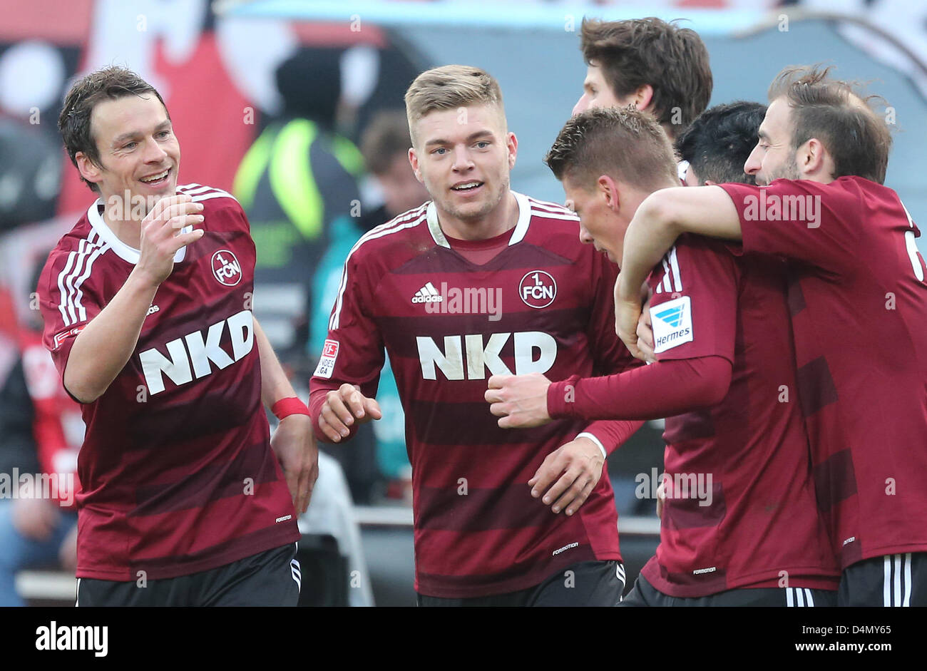 Nuremberg's Mike Frantz (2-R) cheers with Markus Feulner (L) and ...