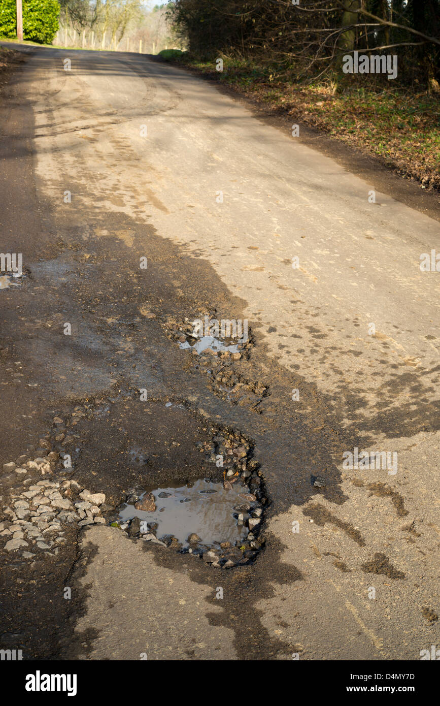 Potholes in a country lane Stock Photo - Alamy