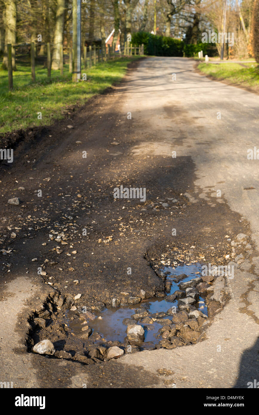 Potholes in a country lane Stock Photo - Alamy