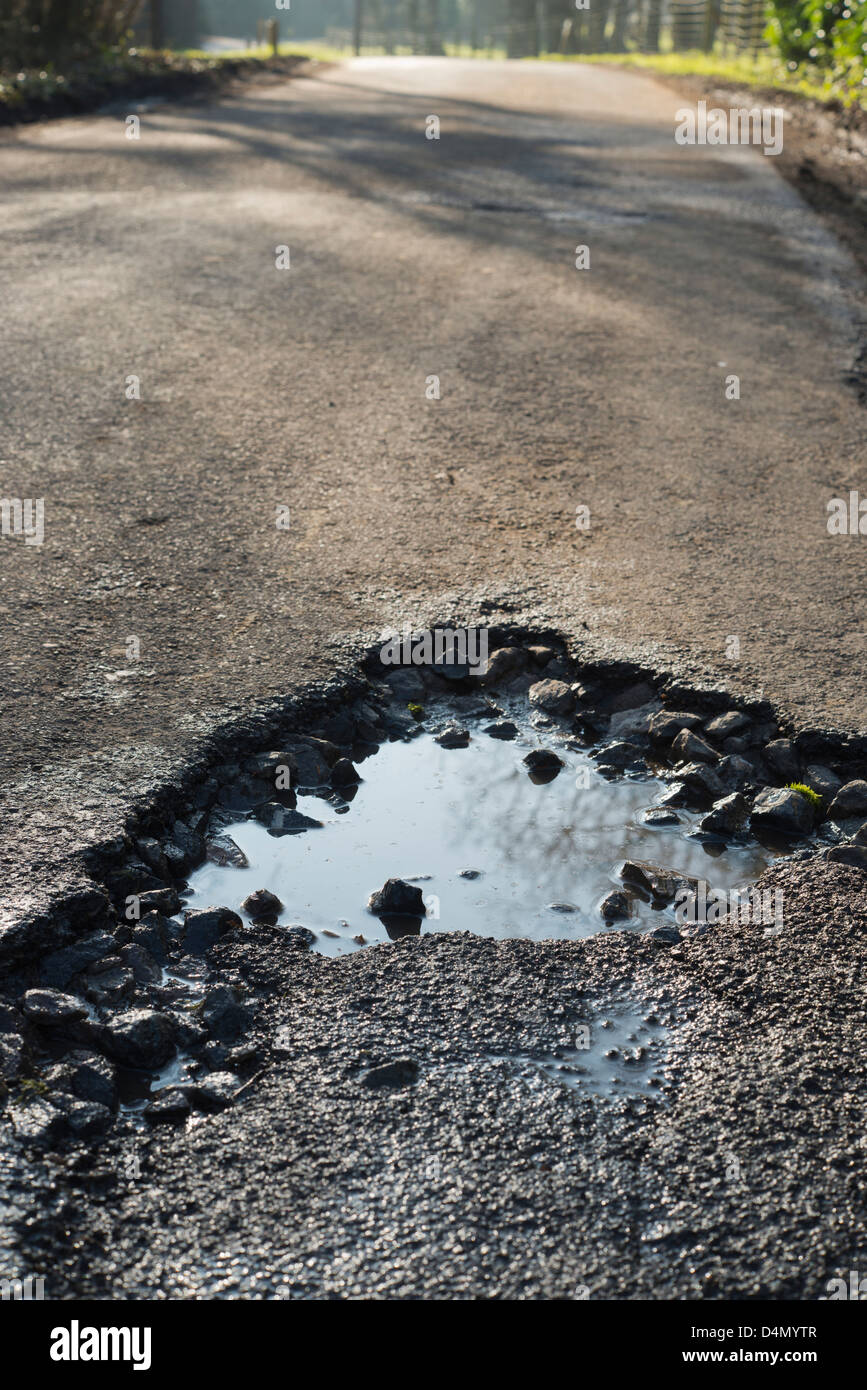Potholes in a country lane Stock Photo - Alamy