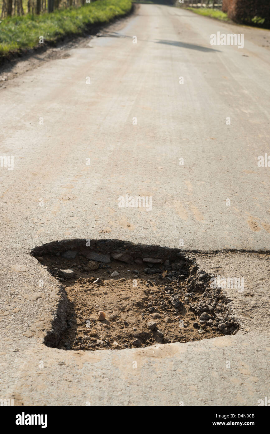 Potholes in a country lane Stock Photo - Alamy