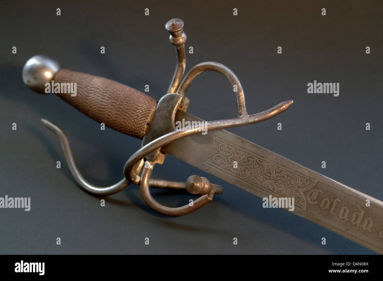 studio photography of a old corroded sword detail with some ornaments ...