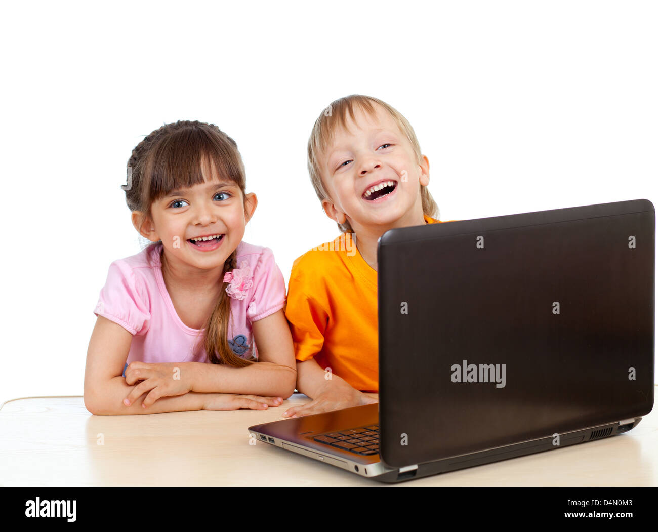 Funny children using a laptop over white background Stock Photo - Alamy