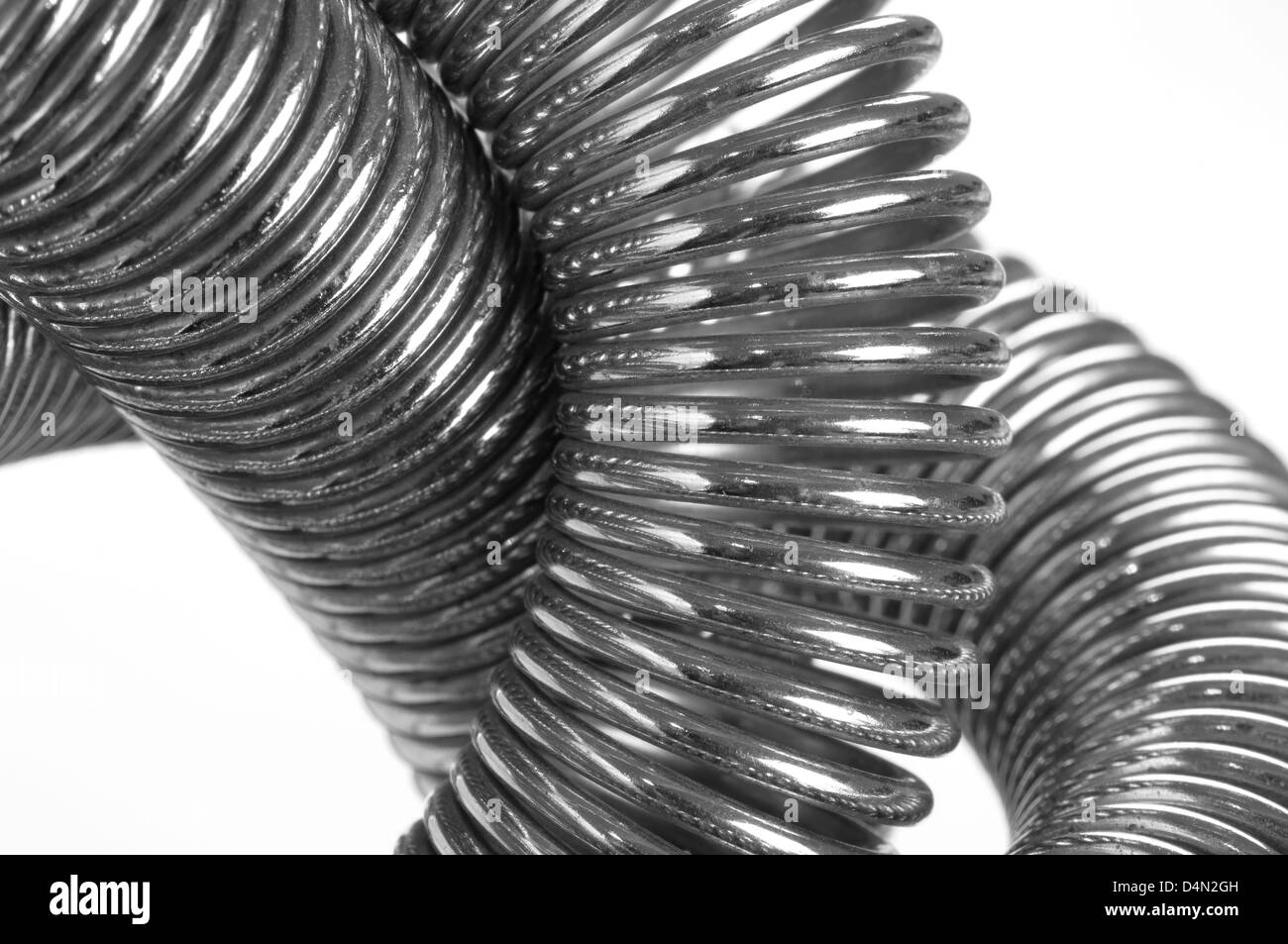 Coiled metal spring abstract background close up isolated Stock Photo ...