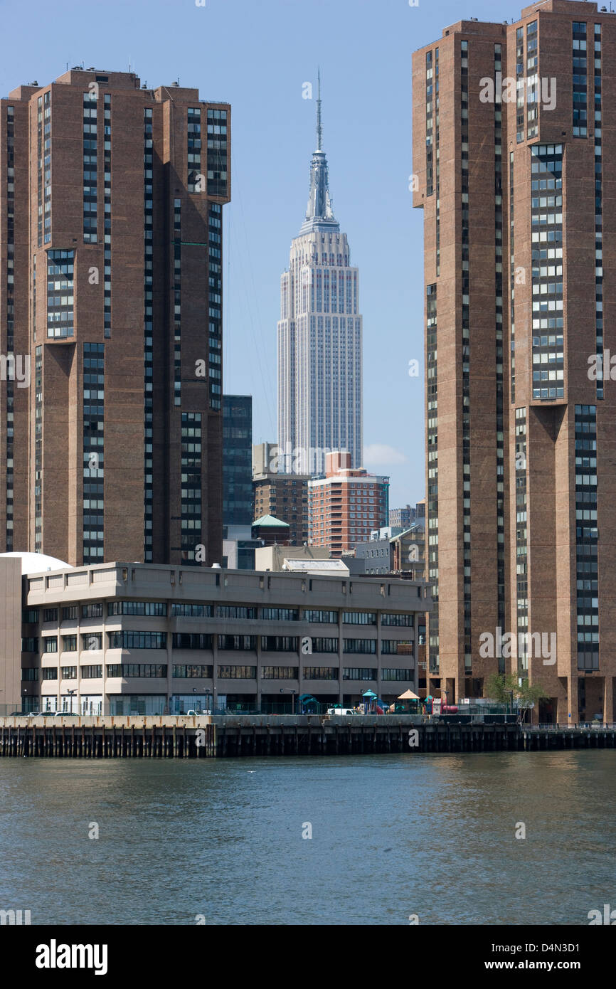 The Empire State Building framed by two tower blocks on the East River ...
