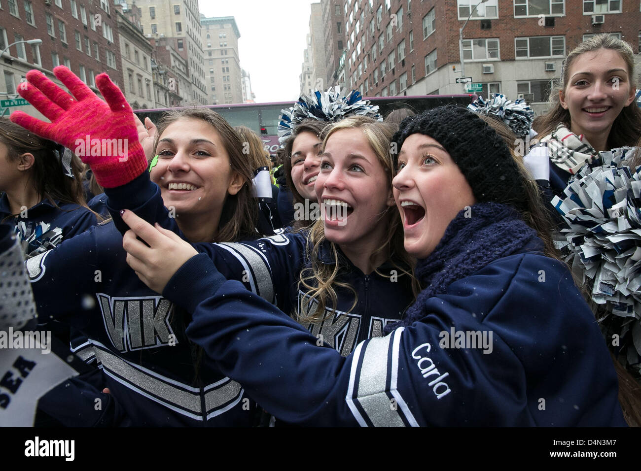 March, 16th, 2013, New York, NY, USA : A group of cheerleaders reach ...