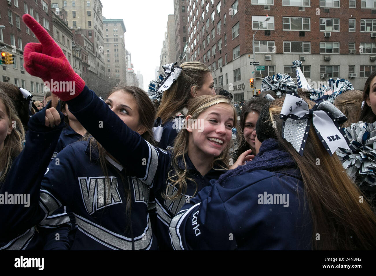 March, 16th, 2013, New York, NY, USA : A group of cheerleaders reach ...