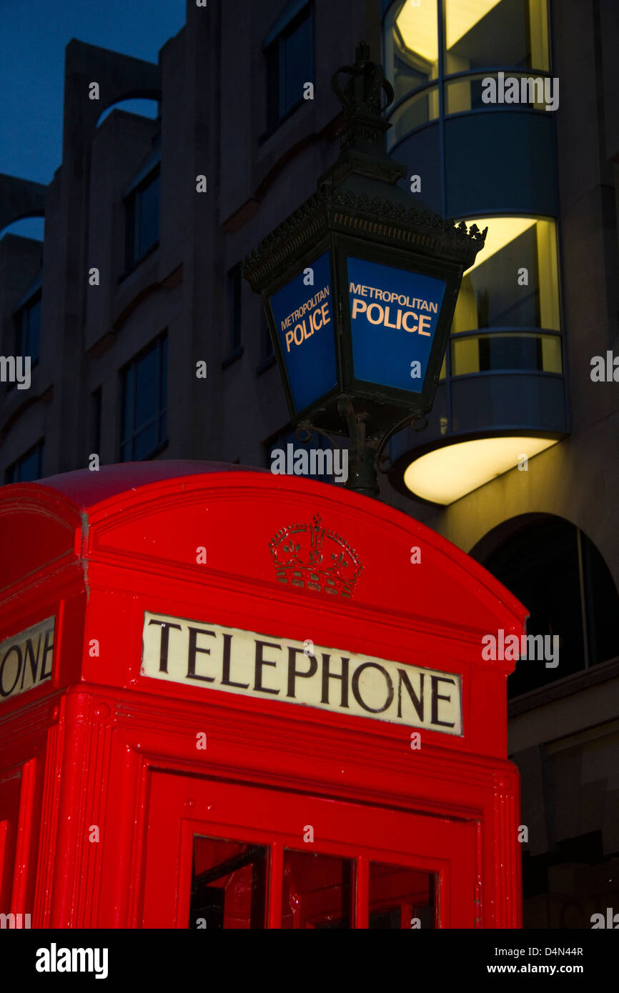 Red telephone box outside police station, Soho, London, England Stock ...