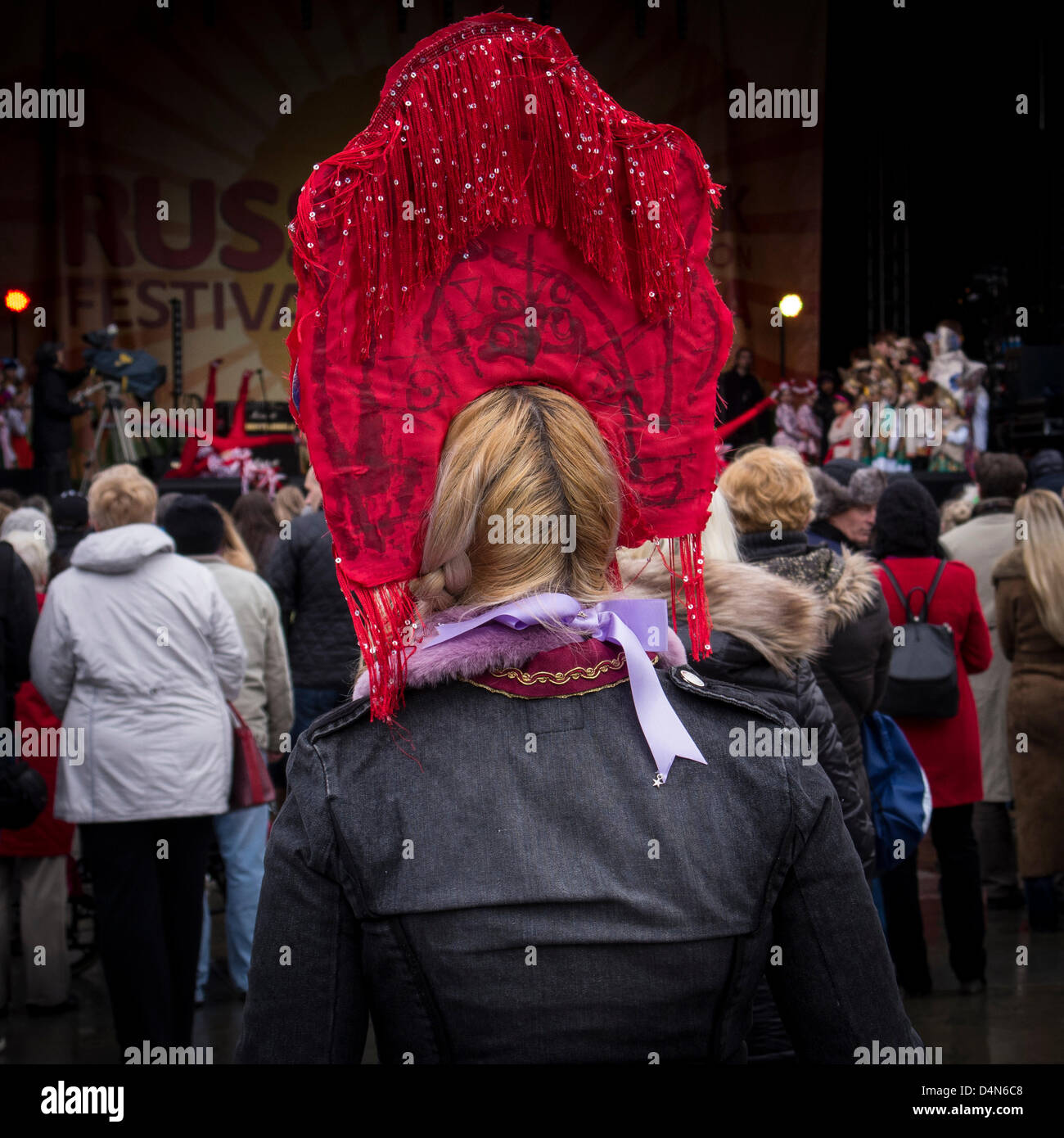A girl wears an elaborate traditional head dress at Maslenitsa, Russian ...