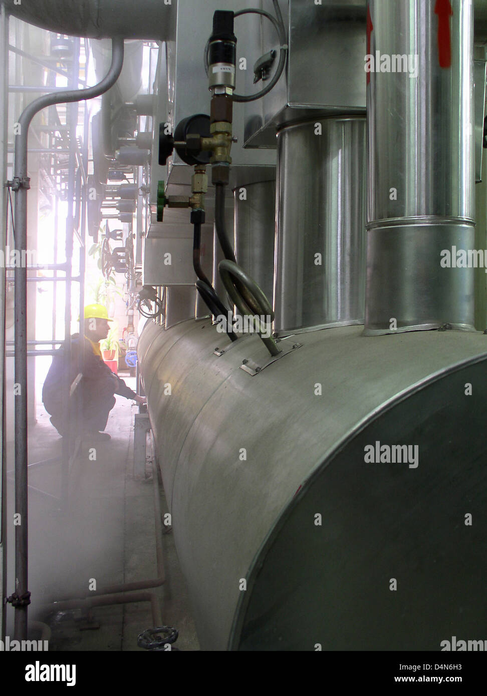 Engineer working on pipeline Stock Photo - Alamy