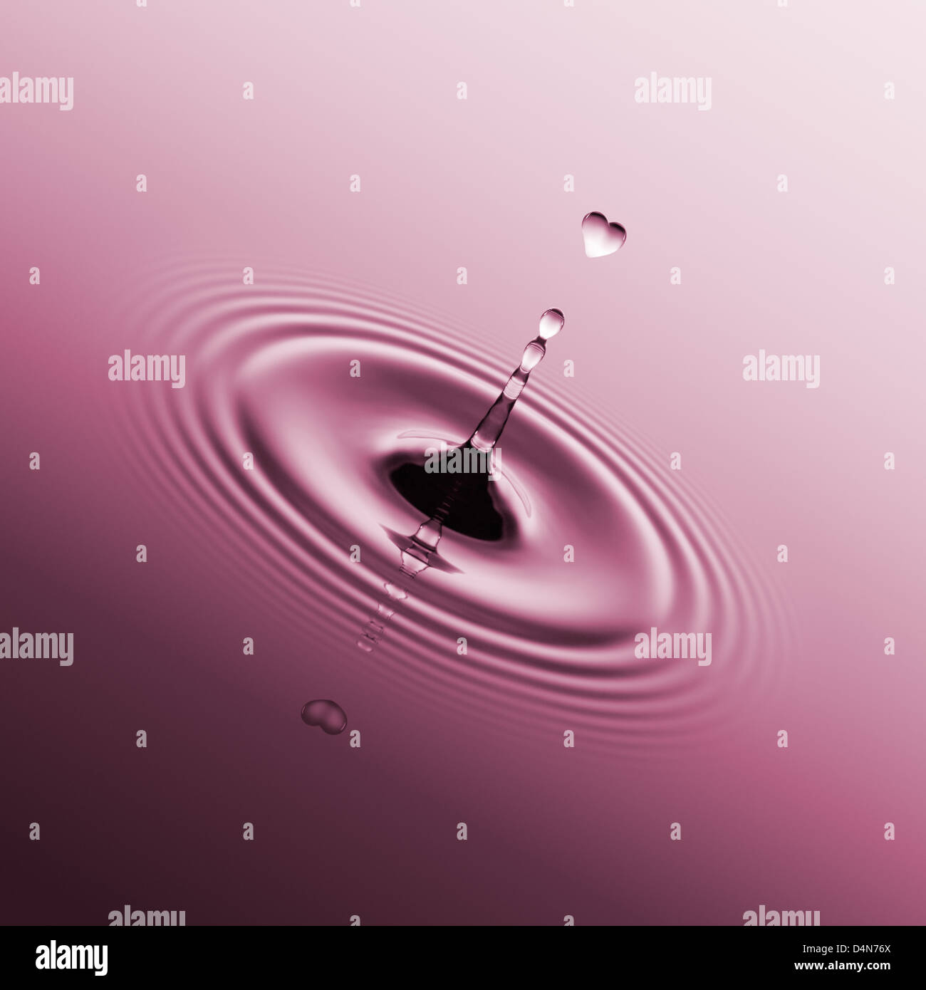 A heart shaped droplet rebound on water Stock Photo - Alamy
