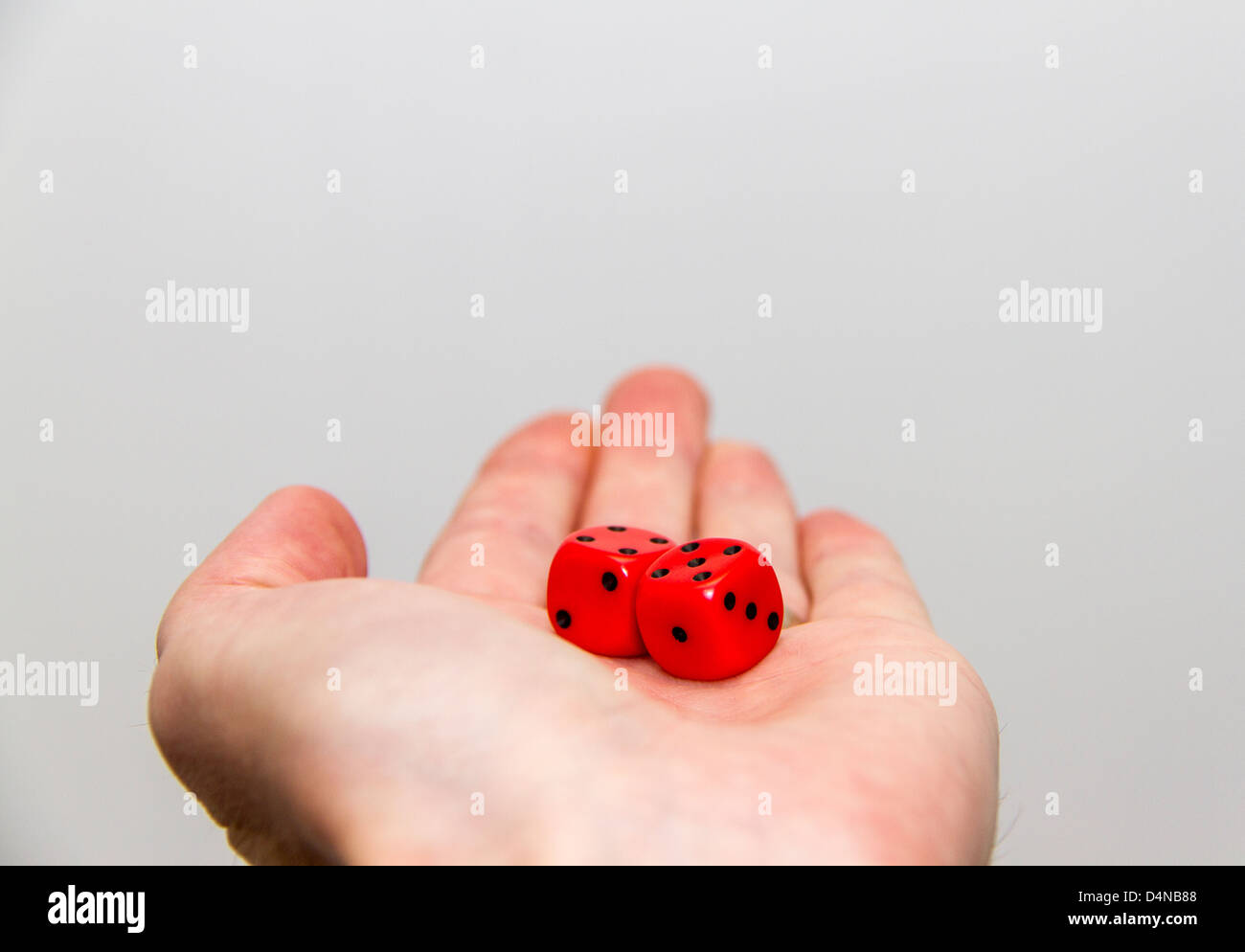 hand holding dice Stock Photo - Alamy