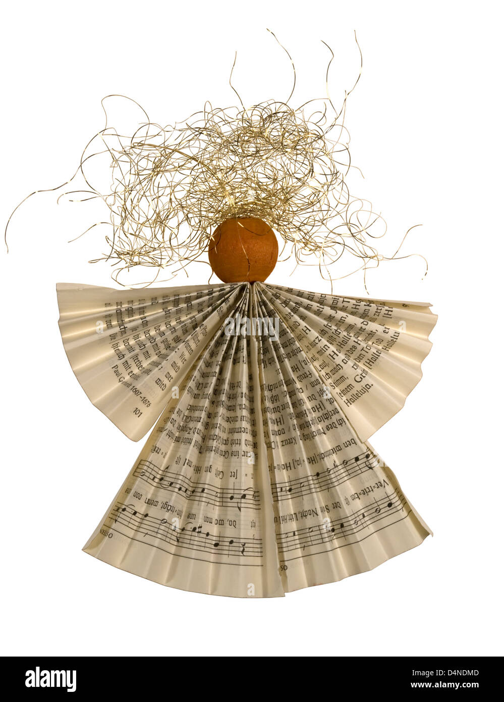 studio photography of a symbolic hand made paper angel in white back ...