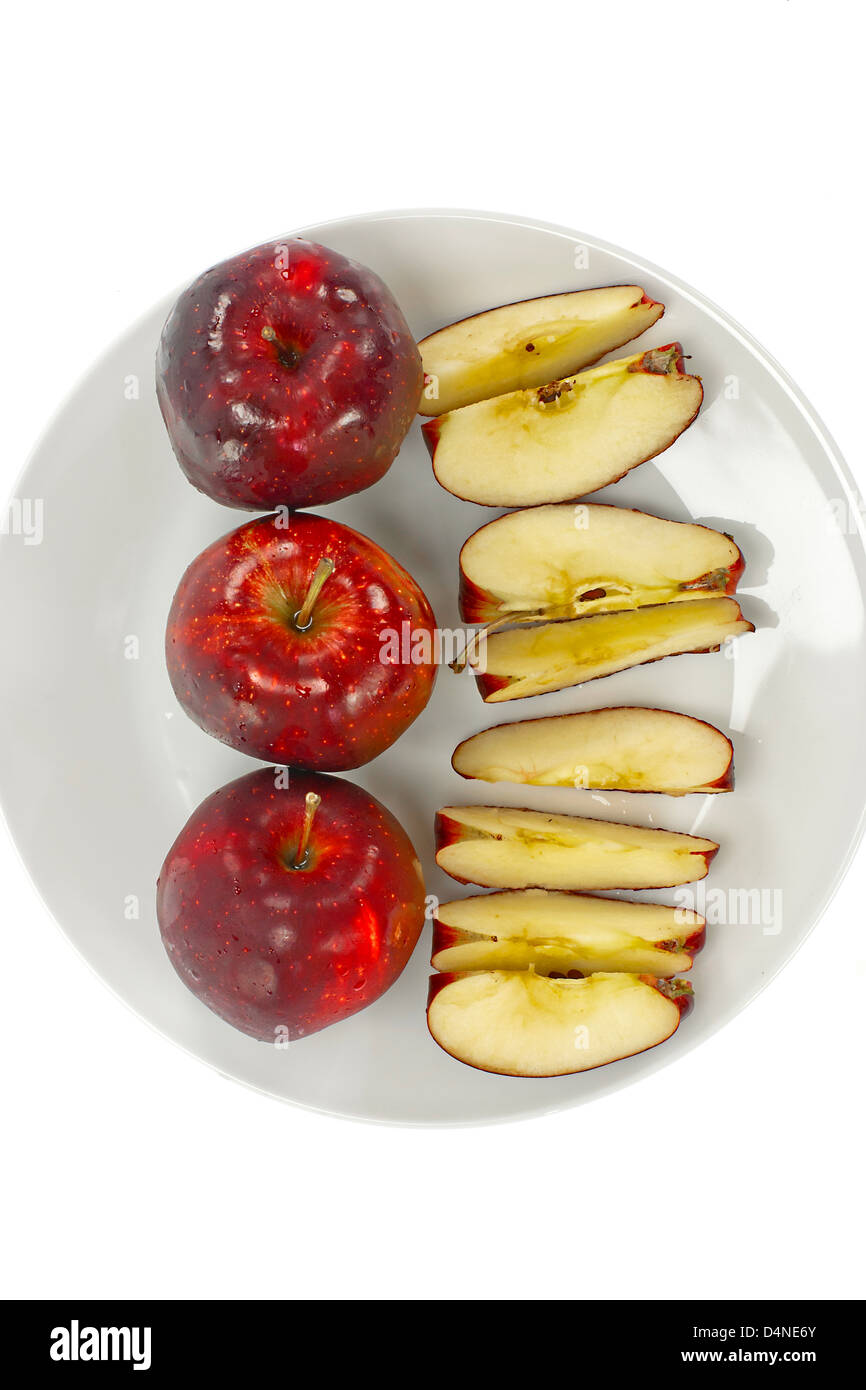 red apple slices isolated white background Stock Photo - Alamy