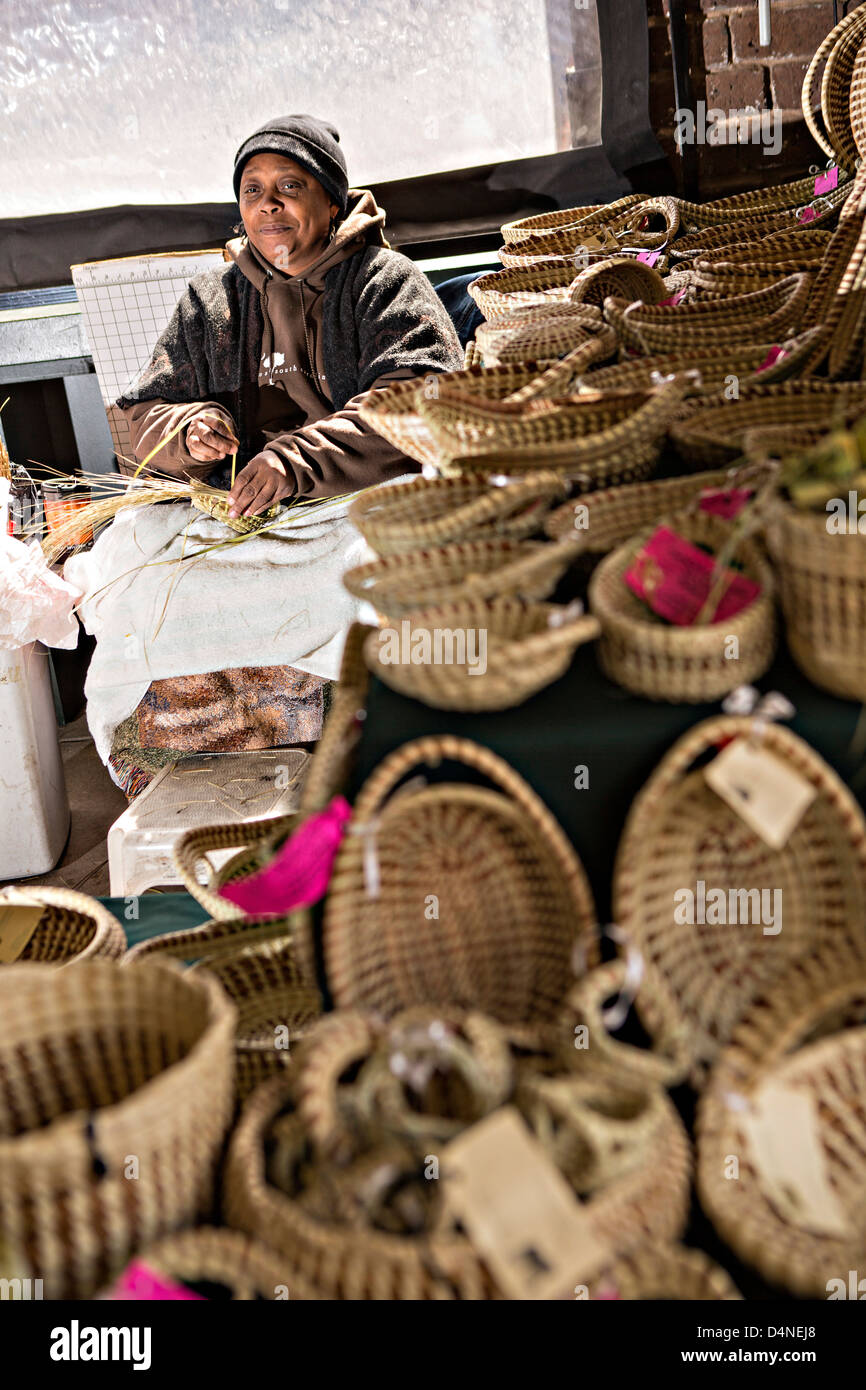 Gullah woman weaving sweetgrass baskets at the Historic Charleston City ...