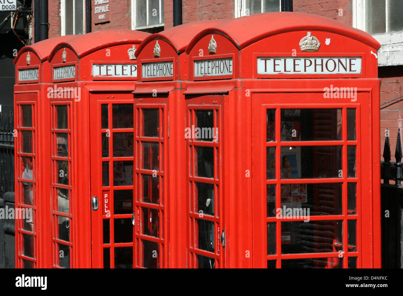 Row of London red telephone boxes Stock Photo - Alamy