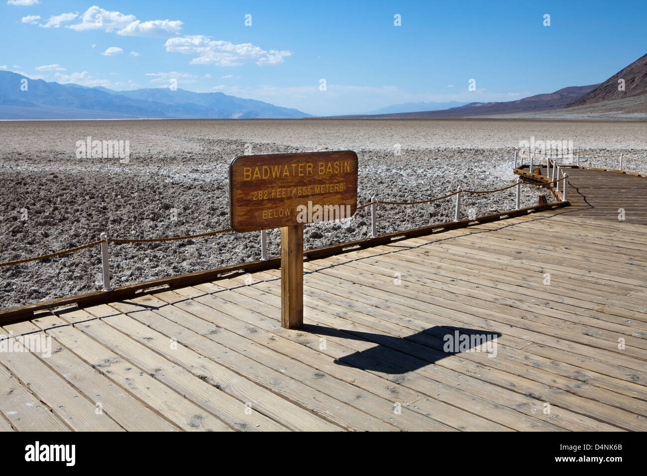 Bad Water' sign beside a lake with mountains in the distance Stock ...
